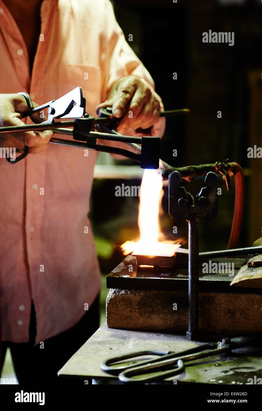 Glassmakers, Glassblowers forming molten glass, glass factory, Ajeto ...