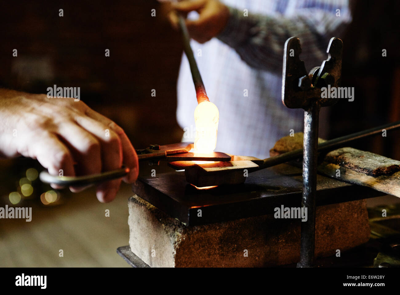 Glassmakers, Glassblowers forming molten glass, glass factory, Ajeto ...