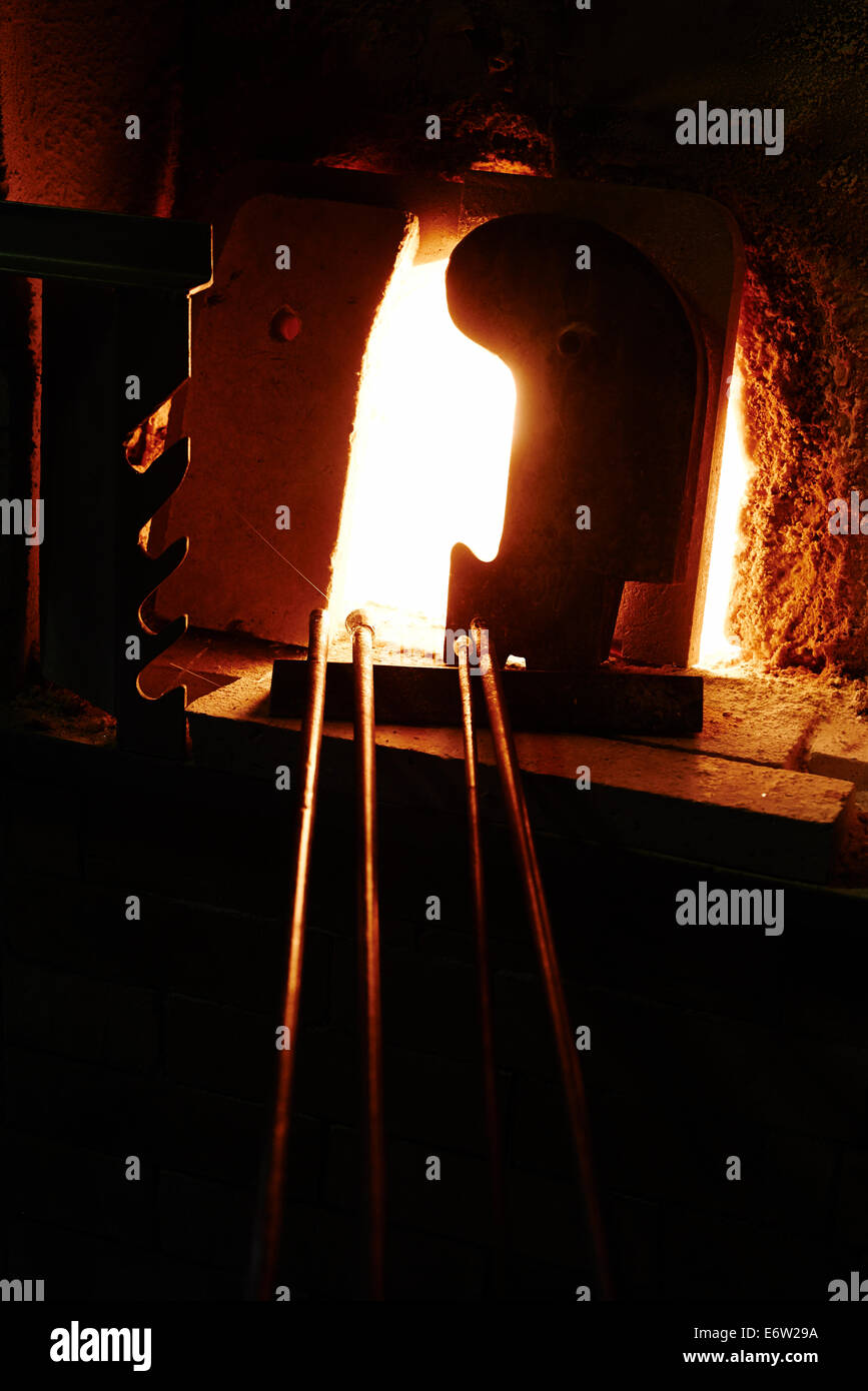 Glassmakers, Glassblowers forming molten glass, glass factory, Ajeto ...