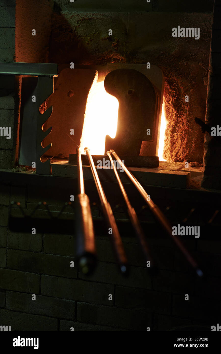 Glassmakers, Glassblowers forming molten glass, glass factory, Ajeto ...
