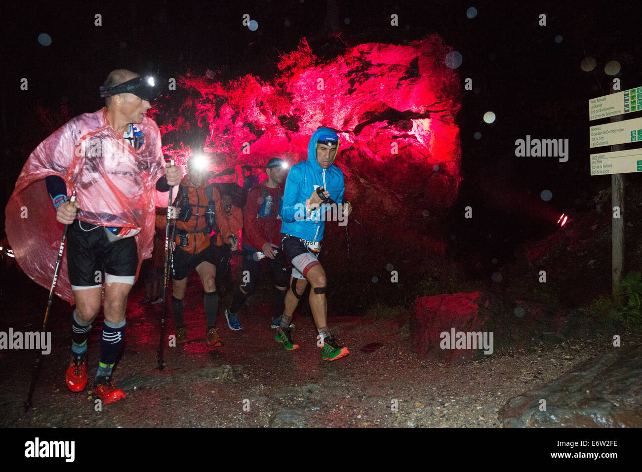 Chamonix, France. 29th Aug, 2014. A runner moves through the Notre Dame ...