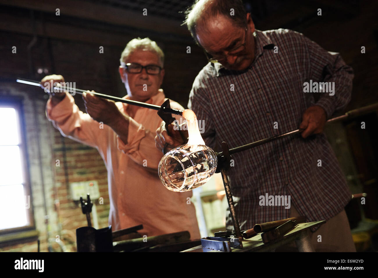 Glassmakers, Glassblowers forming molten glass, glass factory, Ajeto ...