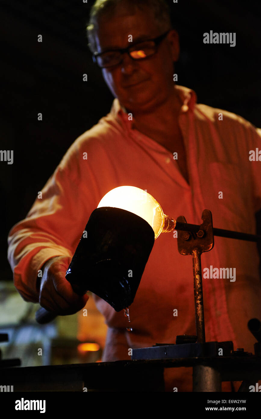 Glassmakers, Glassblowers forming molten glass, glass factory, Ajeto ...