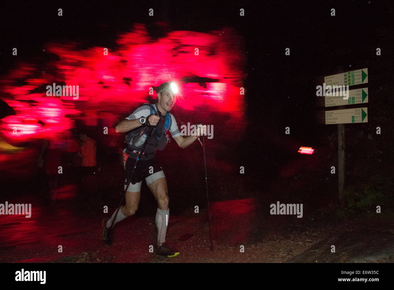 Chamonix, France. 29th Aug, 2014. A runner moves through the Notre Dame ...