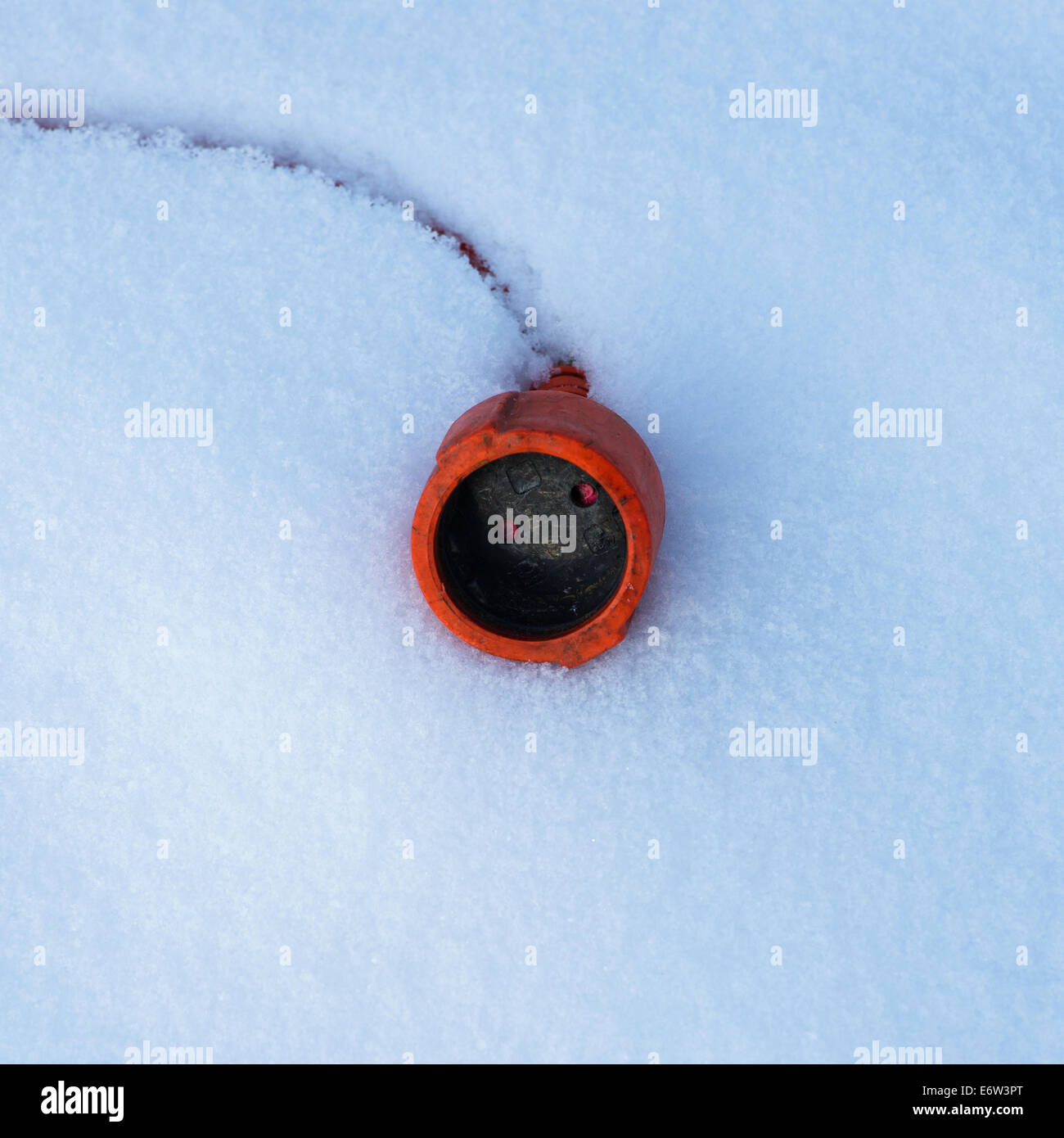 Electrical socket of red color in deep white snow Stock Photo - Alamy