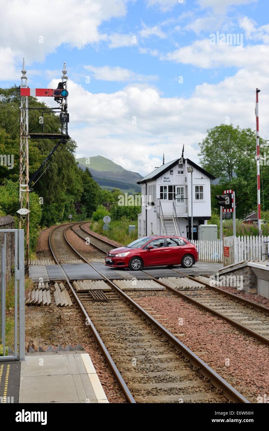 Car driving through level crossing Stock Photo - Alamy