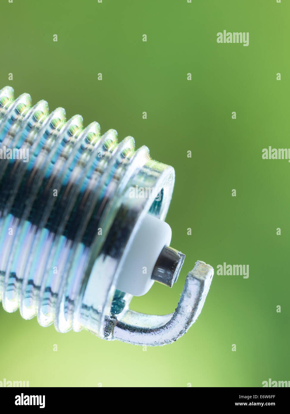 Auto service. New car spark plug as spare part of auto transportation ...