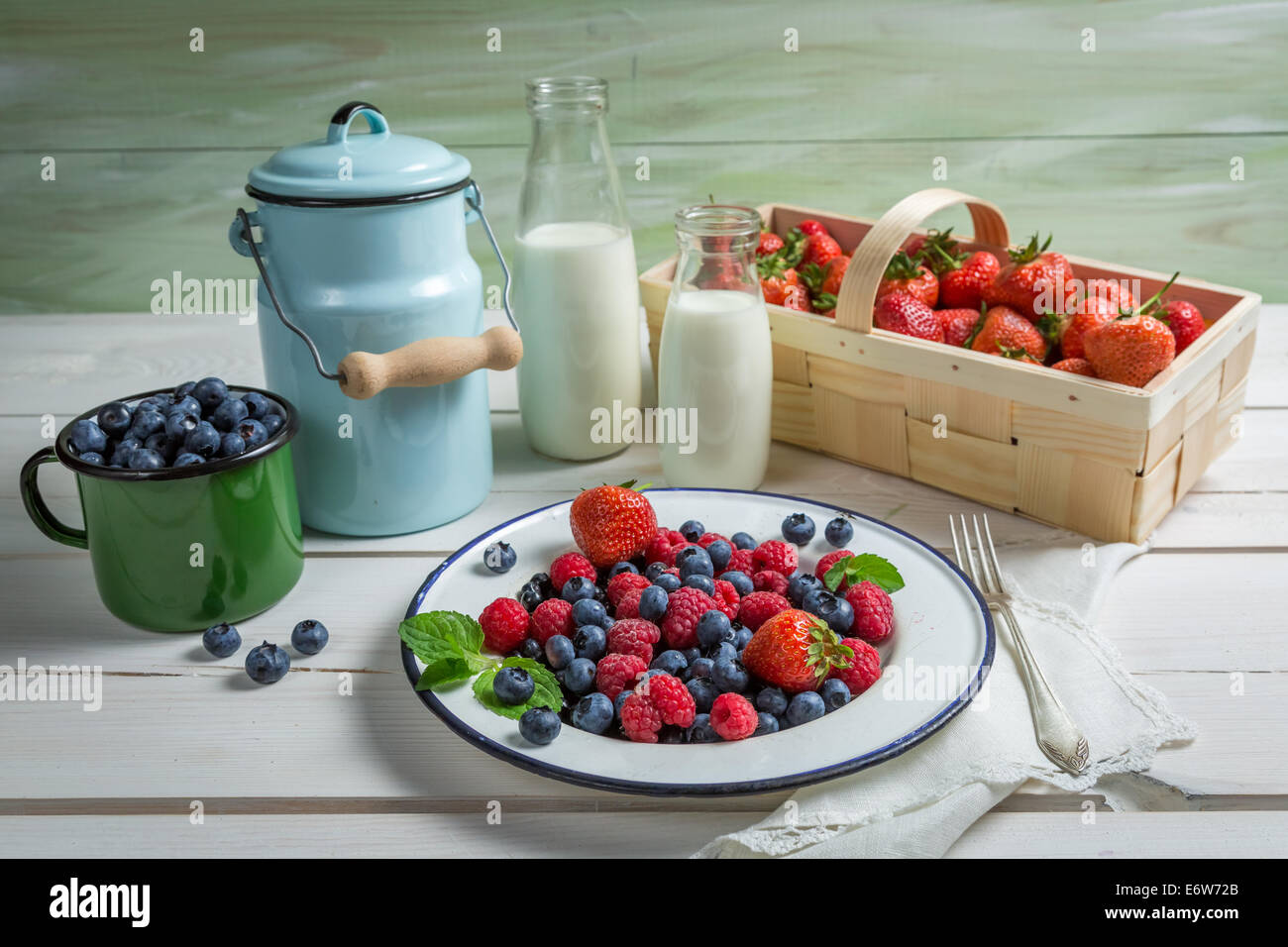 Fresh berry fruits with milk Stock Photo - Alamy