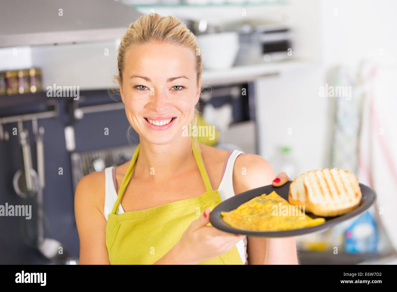Young Mother Cooking at Home Stock Photo - Alamy