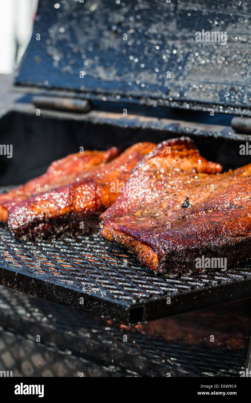 Baby back ribs prepared in smoker Stock Photo - Alamy