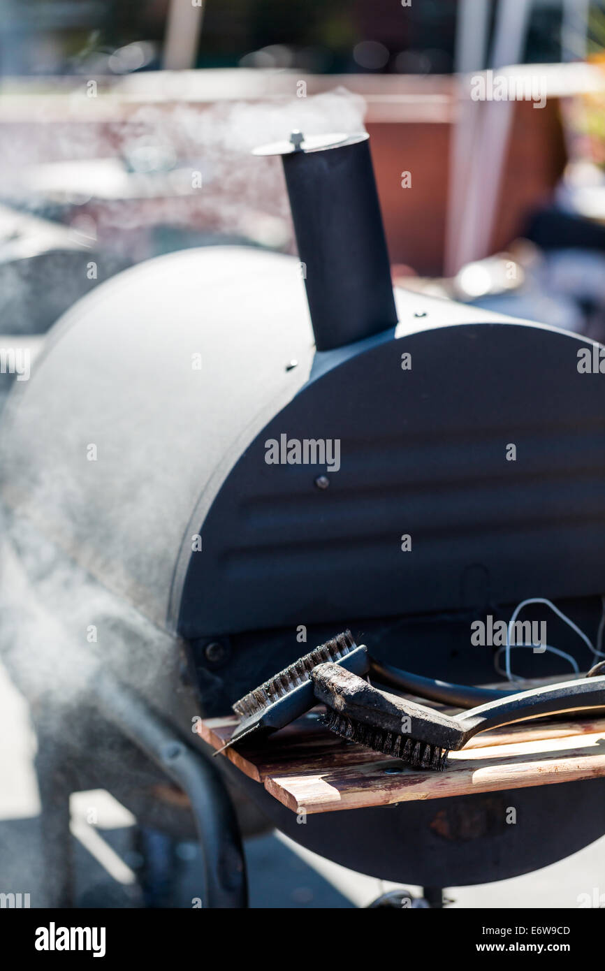 Large barbecue smoker cooking meat Stock Photo - Alamy