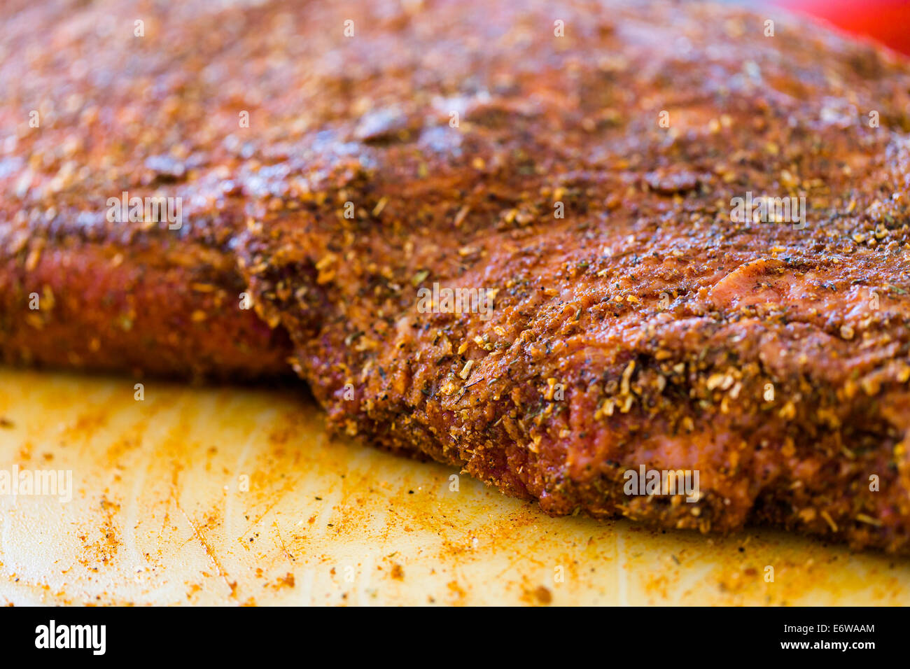 Large slab of meat seasoned ready to be cooked in smoker Stock Photo ...