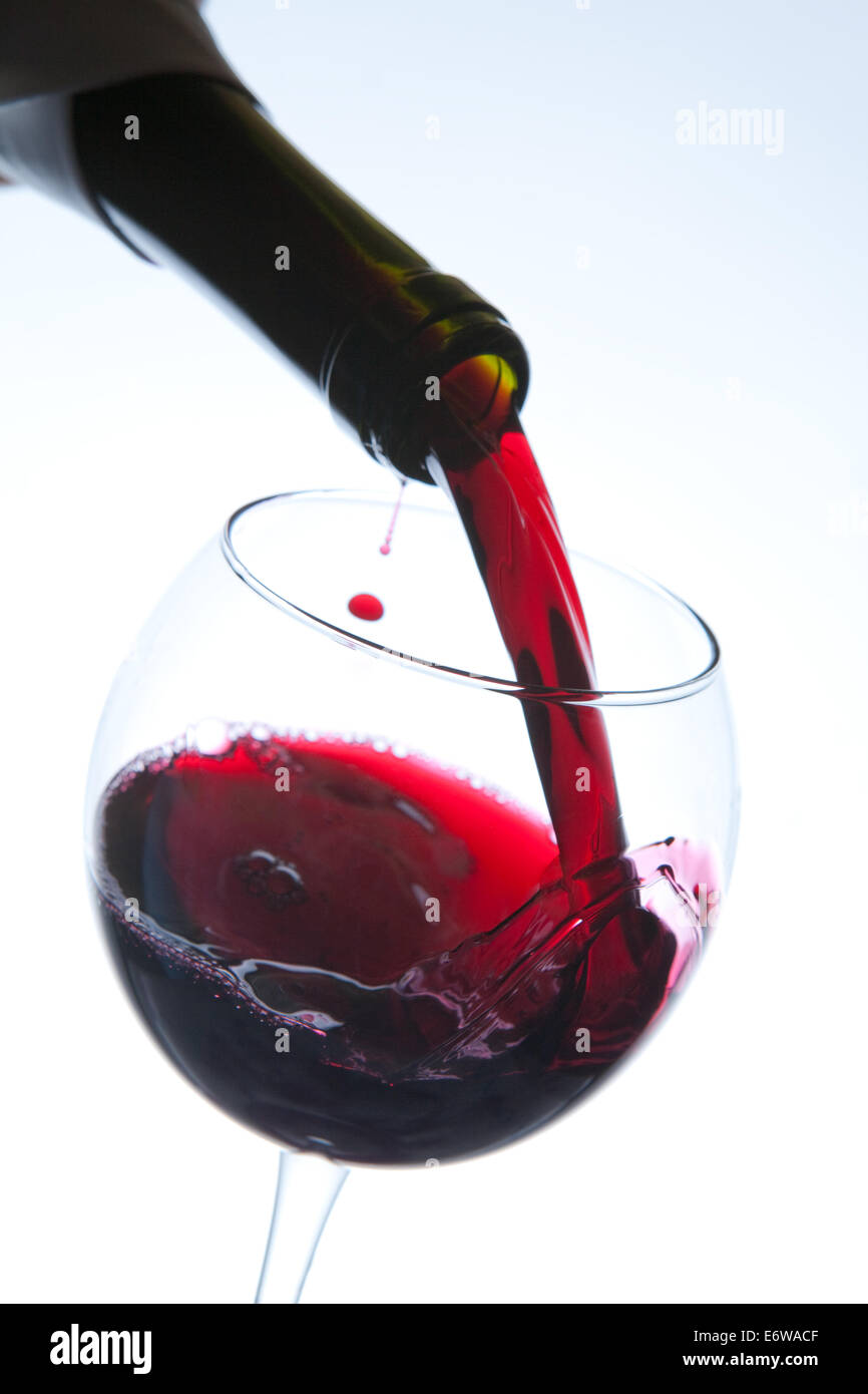Glass pouring bottle pour wineglass hi-res stock photography and images ...
