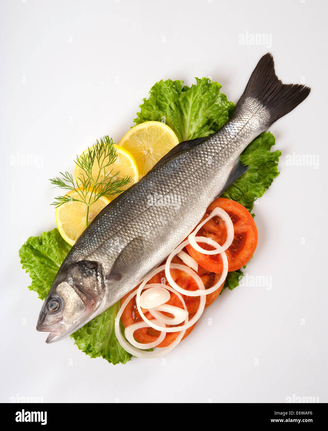 Freshly Bass Fish with vegetables Stock Photo - Alamy