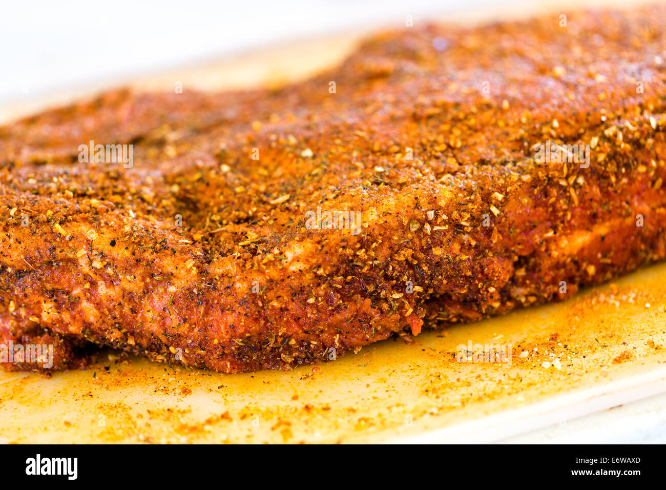 Large slab of meat seasoned ready to be cooked in smoker Stock Photo ...