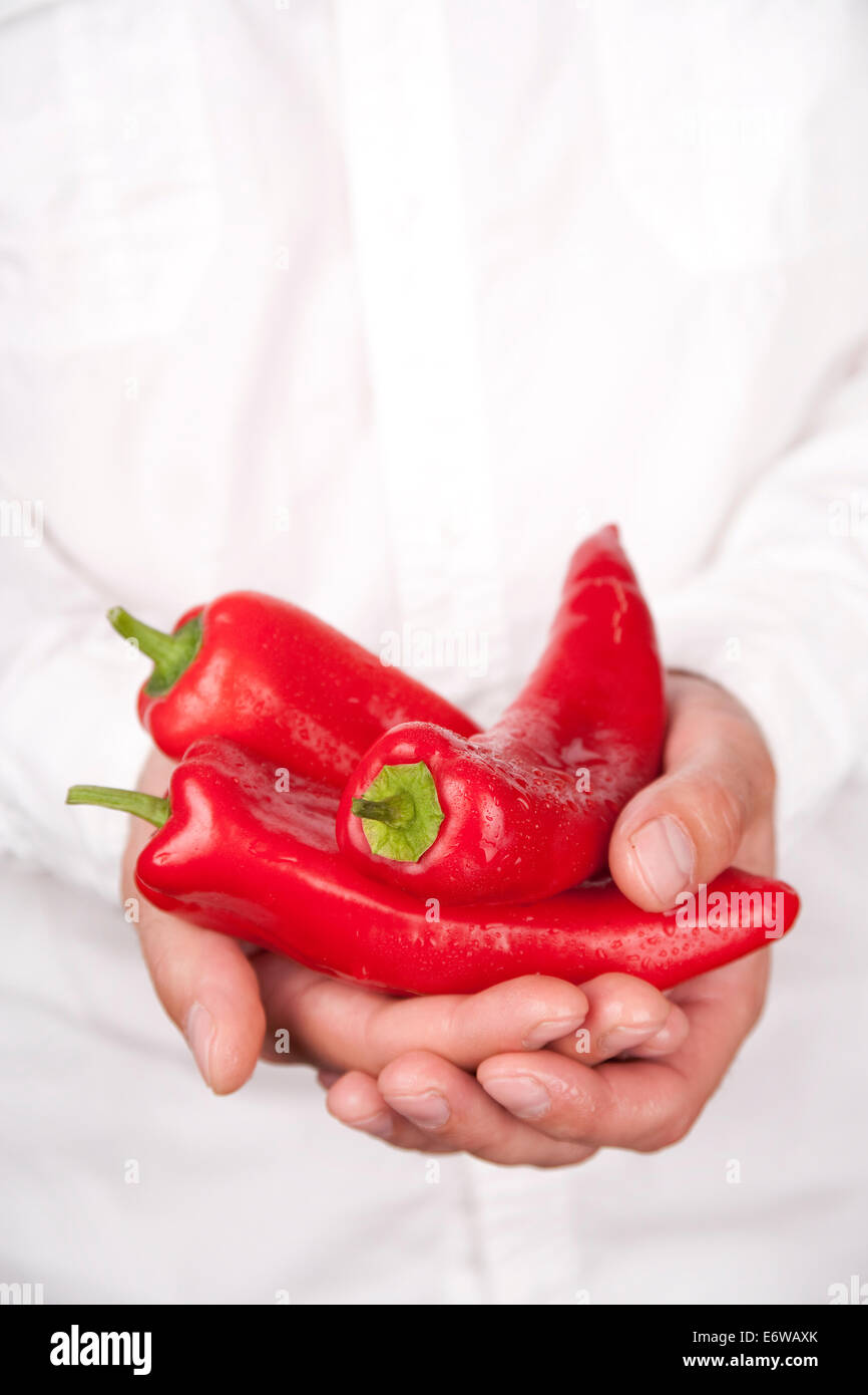 Hands holding peppers Stock Photo - Alamy