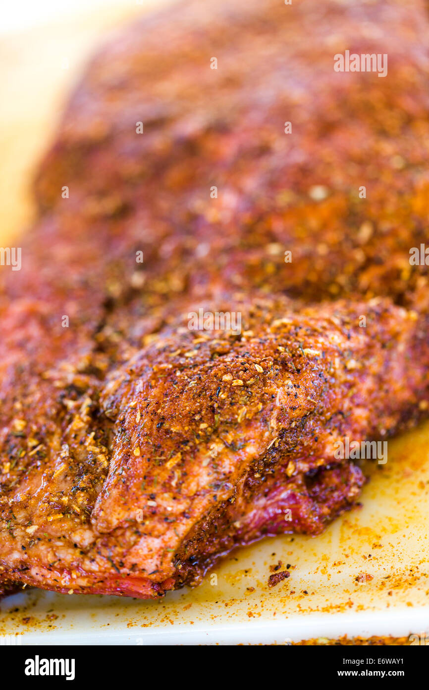 Large slab of meat seasoned ready to be cooked in smoker Stock Photo ...