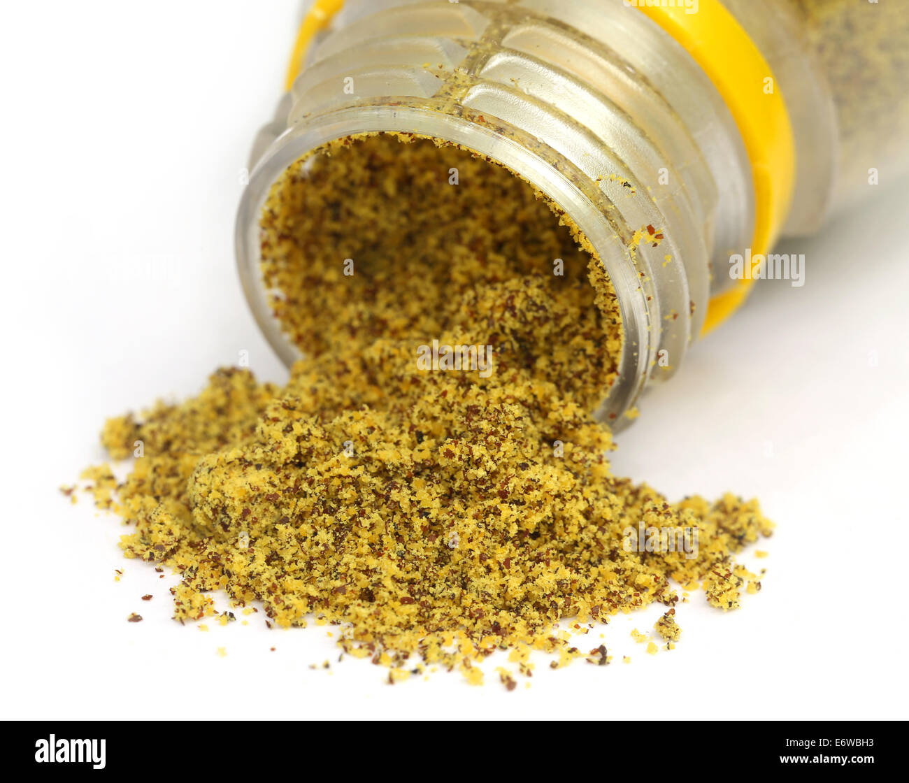 Grated Mustard spilled from a bottle Stock Photo - Alamy