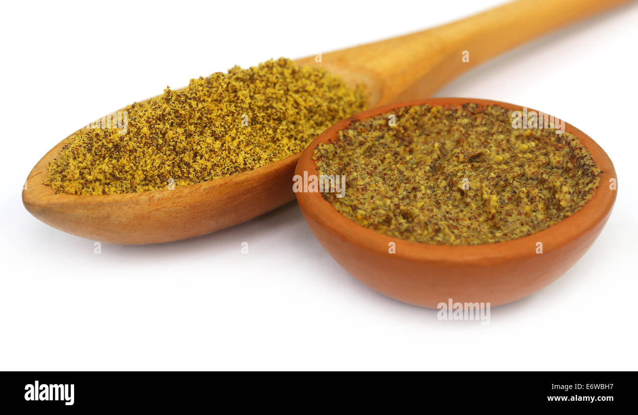 Grated Mustard and paste over white background Stock Photo - Alamy