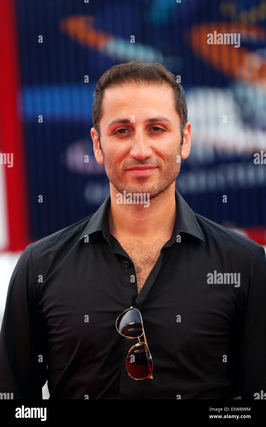 Venice, Italy. 31st Aug, 2014. Actor George Georgiou poses at the ...