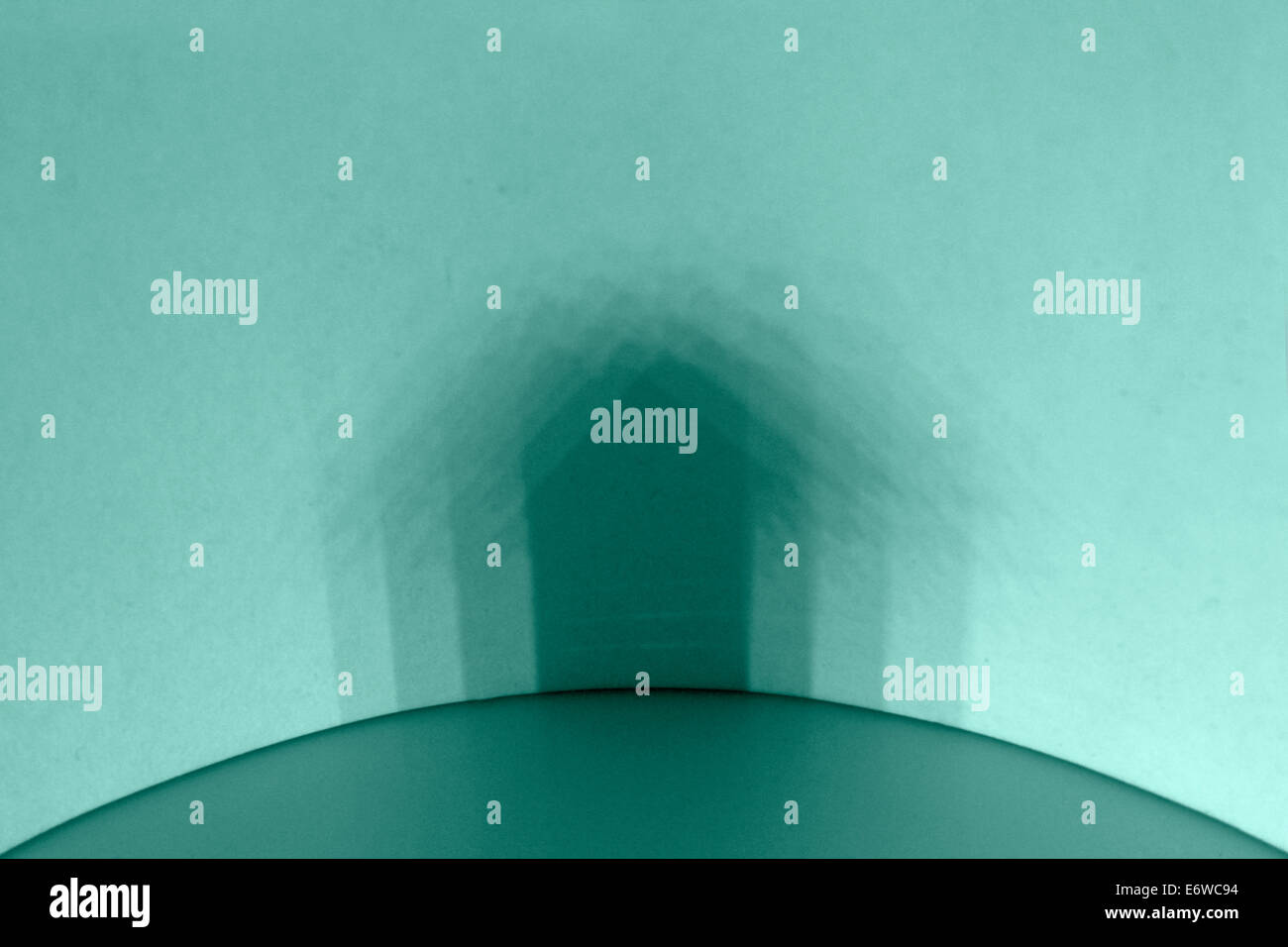 Multiple shadow of Miniature Home on wall Stock Photo - Alamy