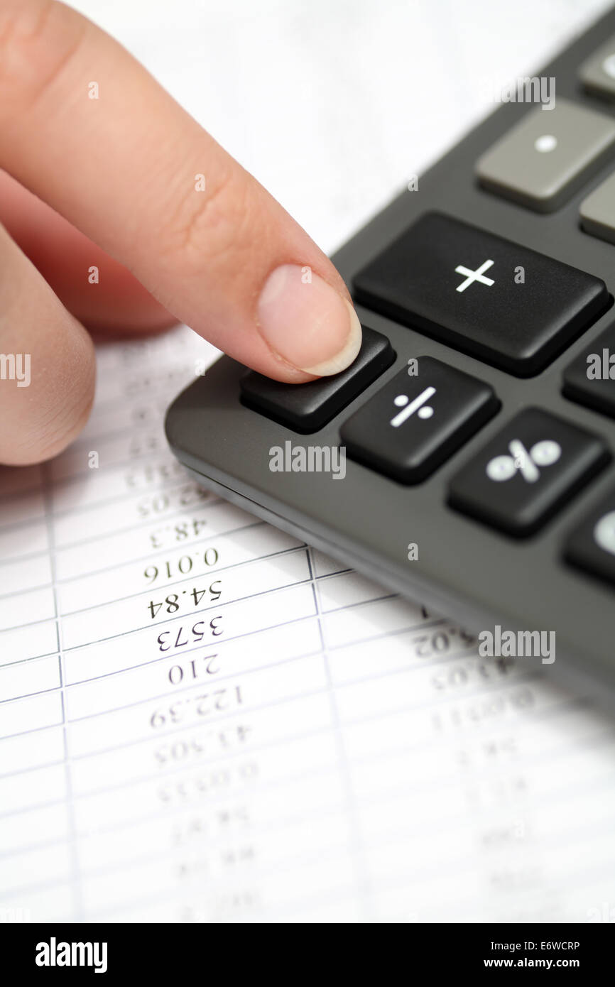 Calculating on a calculator. Financial statements. Close-up Stock Photo ...