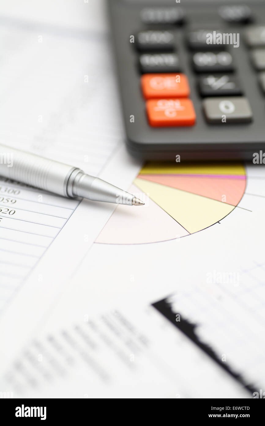 Financial statements. Business Graph. Focus on pen. Shallow depth of ...