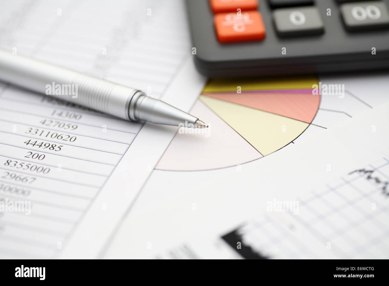 Financial statements. Business Graph. Focus on pen. Shallow depth of ...