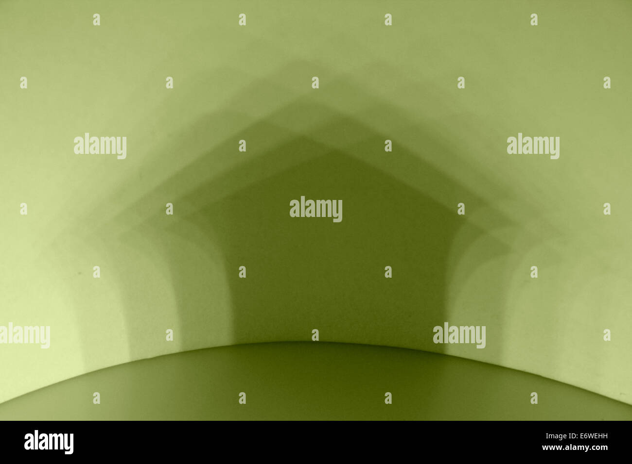 Multiple shadow of Miniature Home on wall Stock Photo - Alamy