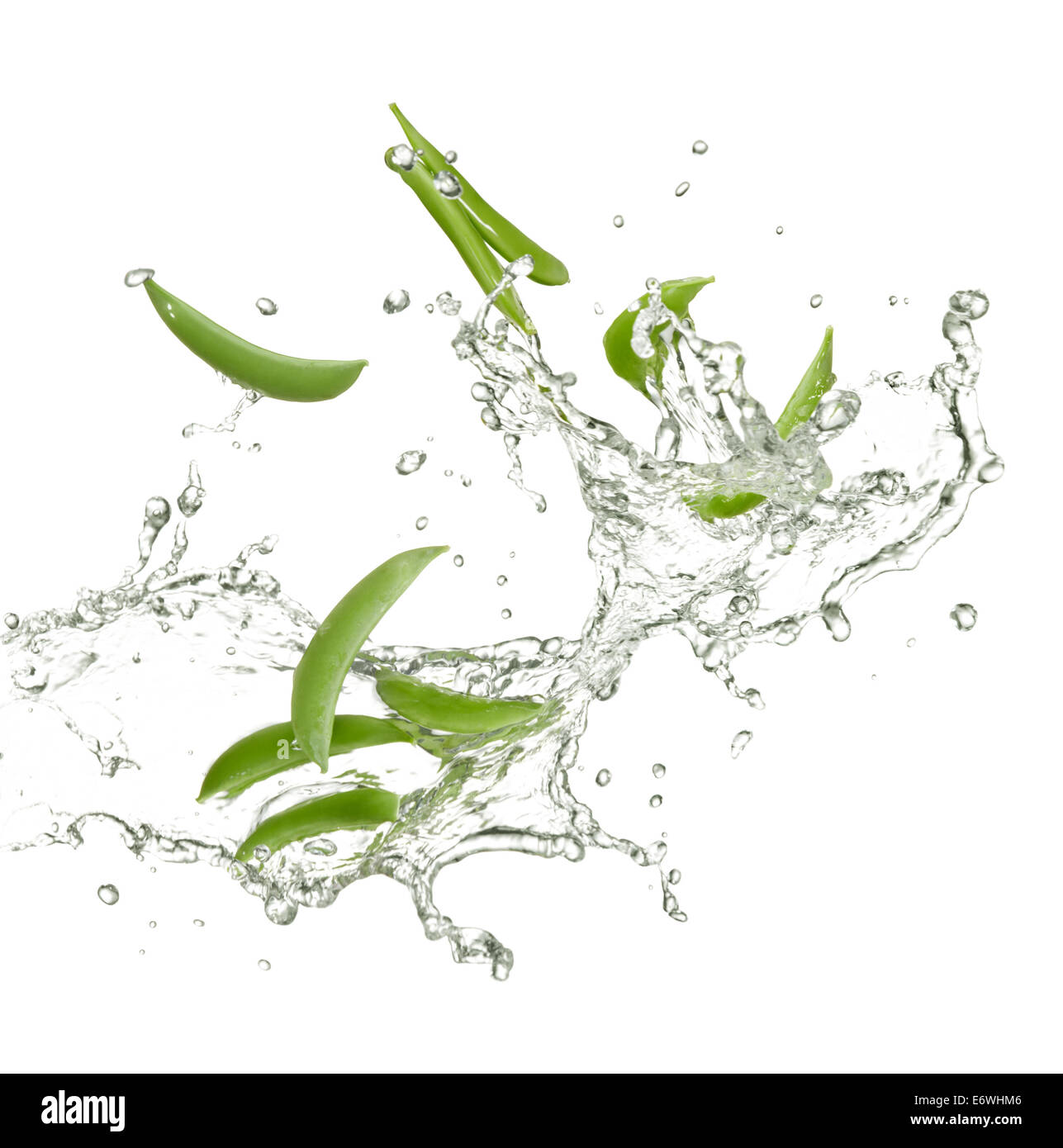 fresh green peas with water splash on white background Stock Photo - Alamy