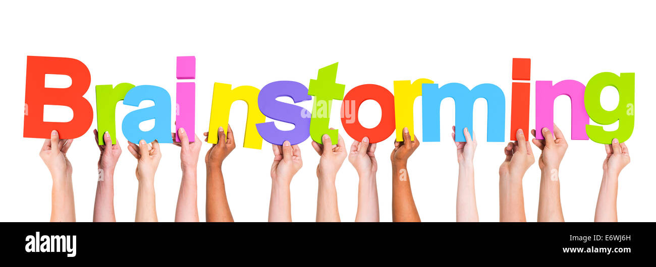 Diverse Hands Holding The Word Brainstorming Stock Photo - Alamy