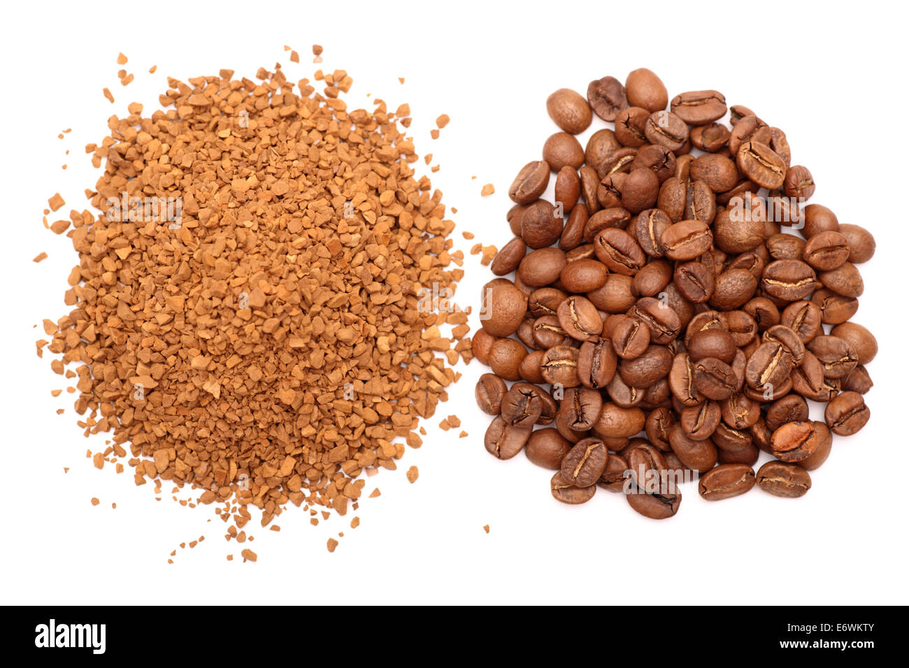 Coffee beans and instant coffee heaps on white background. Closeup ...