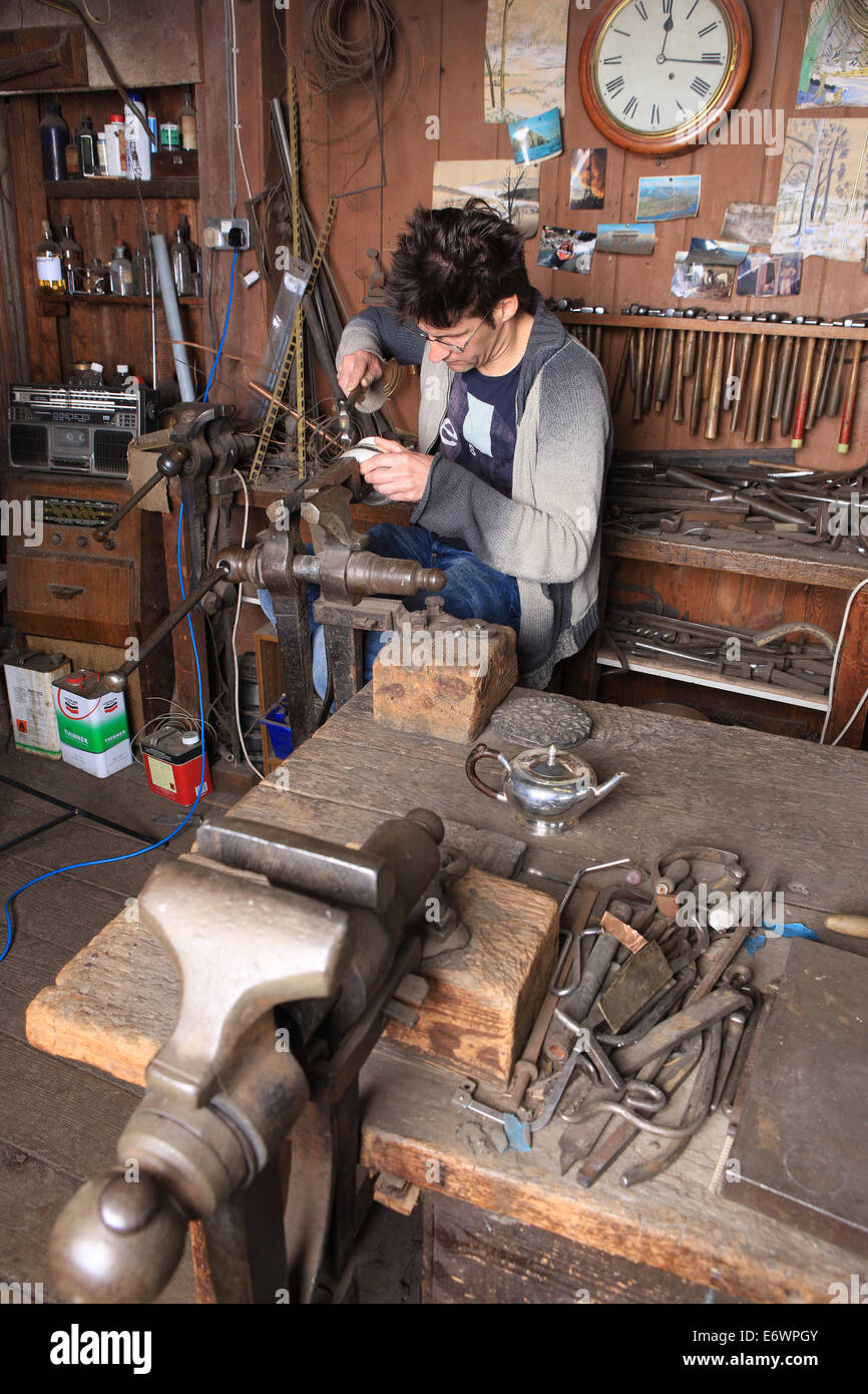 William Hart a Gold & Silversmith working in his Arts and Craft ...