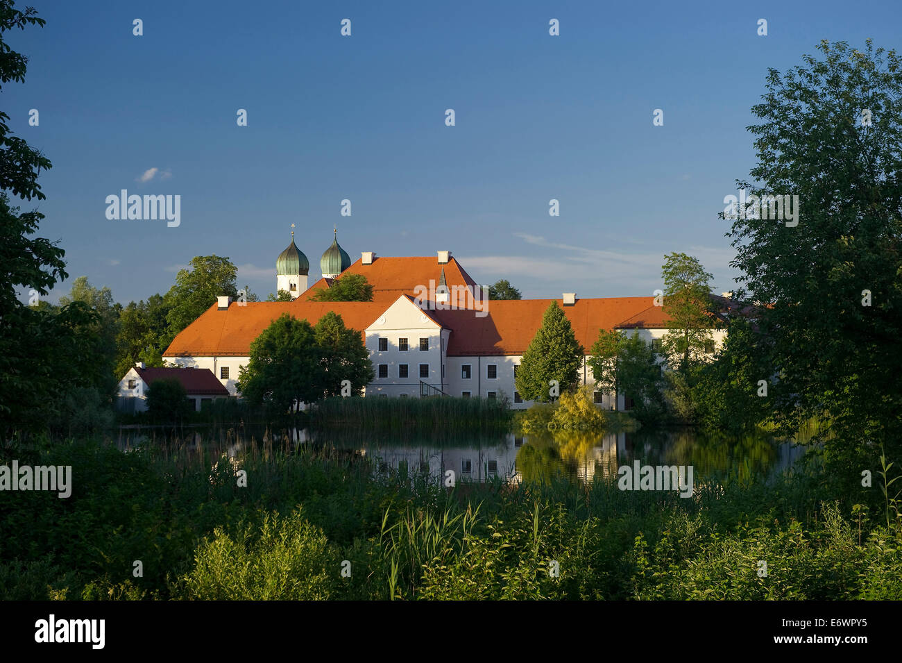 Seeon Abbey reflecting in the lake, Seeon, Chiemgau, Bavaria, Germany ...