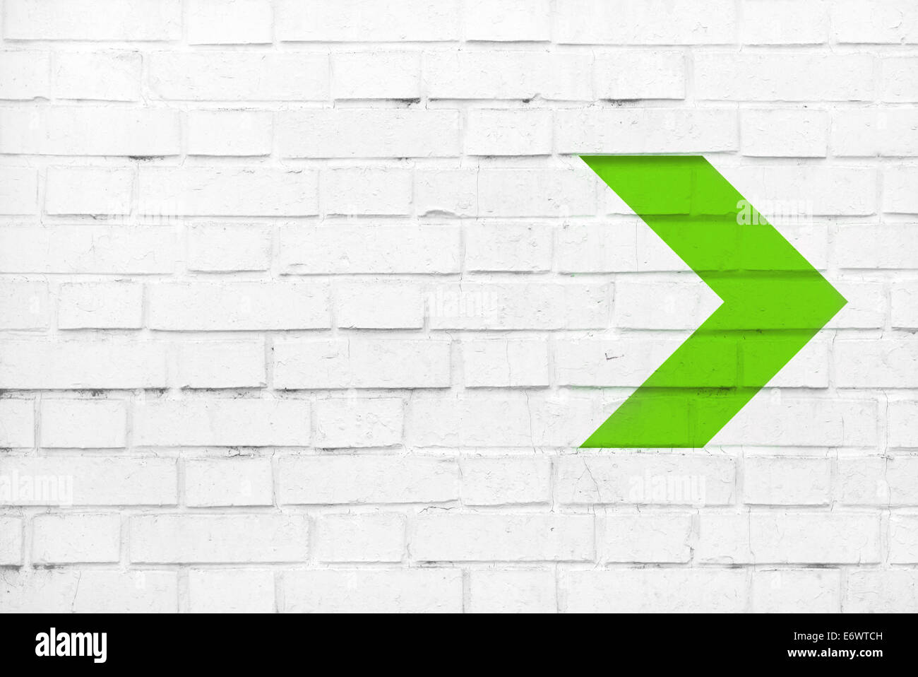 Arrow on white wall hi-res stock photography and images - Alamy