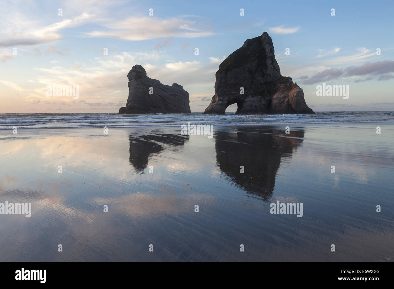 Wharariki Beach and Archway Islands with reflection, South Island, New Zealand Stock Photo - Alamy