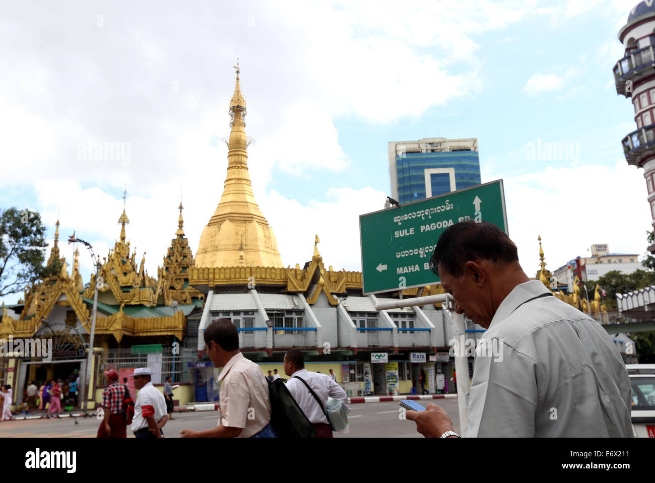 Yangon. 1st Sept, 2014. A man uses a mobile phone in Yangon, Myanmar ...