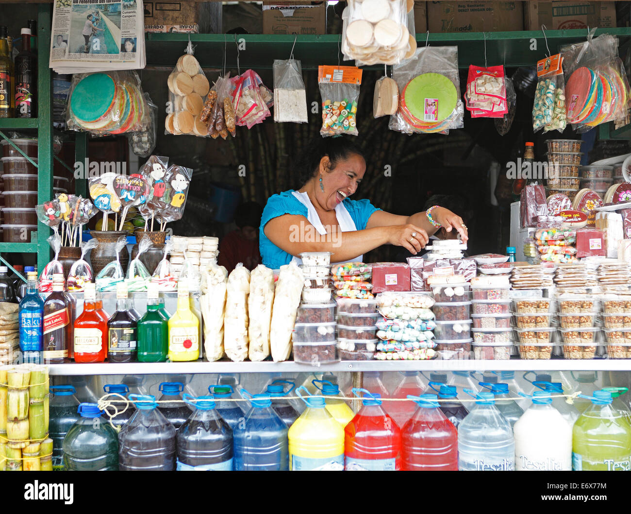 Woman selling sweets and drinks made from sugar cane, Puyo, Pastaza ...