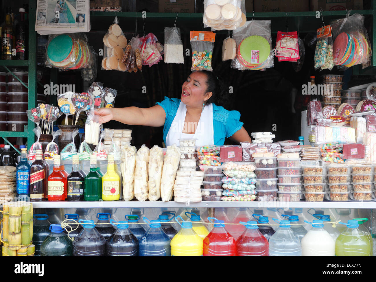 Woman selling sweets and drinks made from sugar cane, Puyo, Pastaza ...