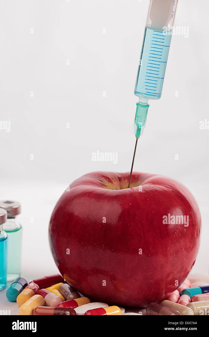 Apple with Needle Stock Photo - Alamy