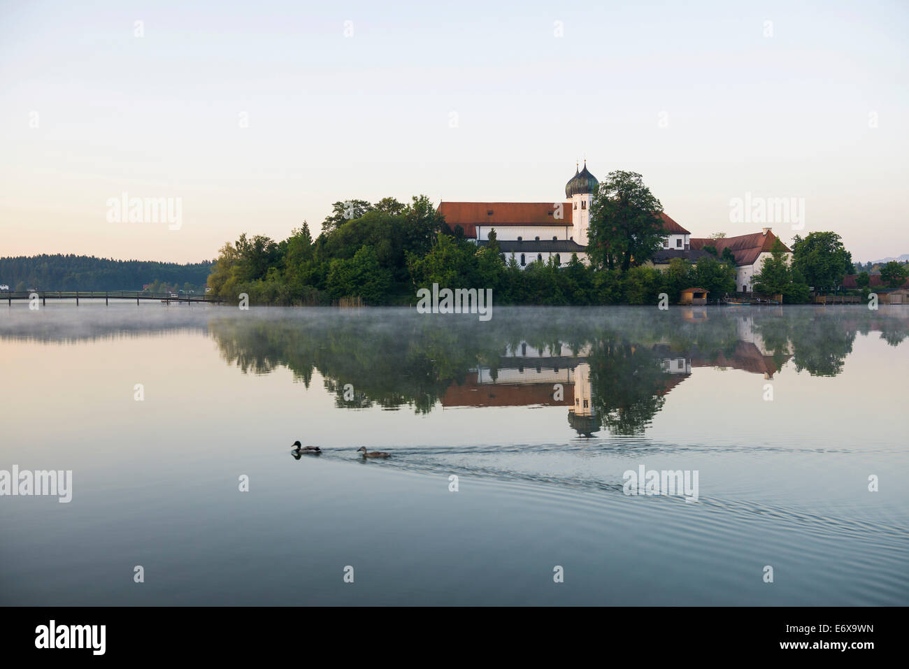 Early morning at Seeon Abbey on an island in Seeoner See Lake, Seeon ...