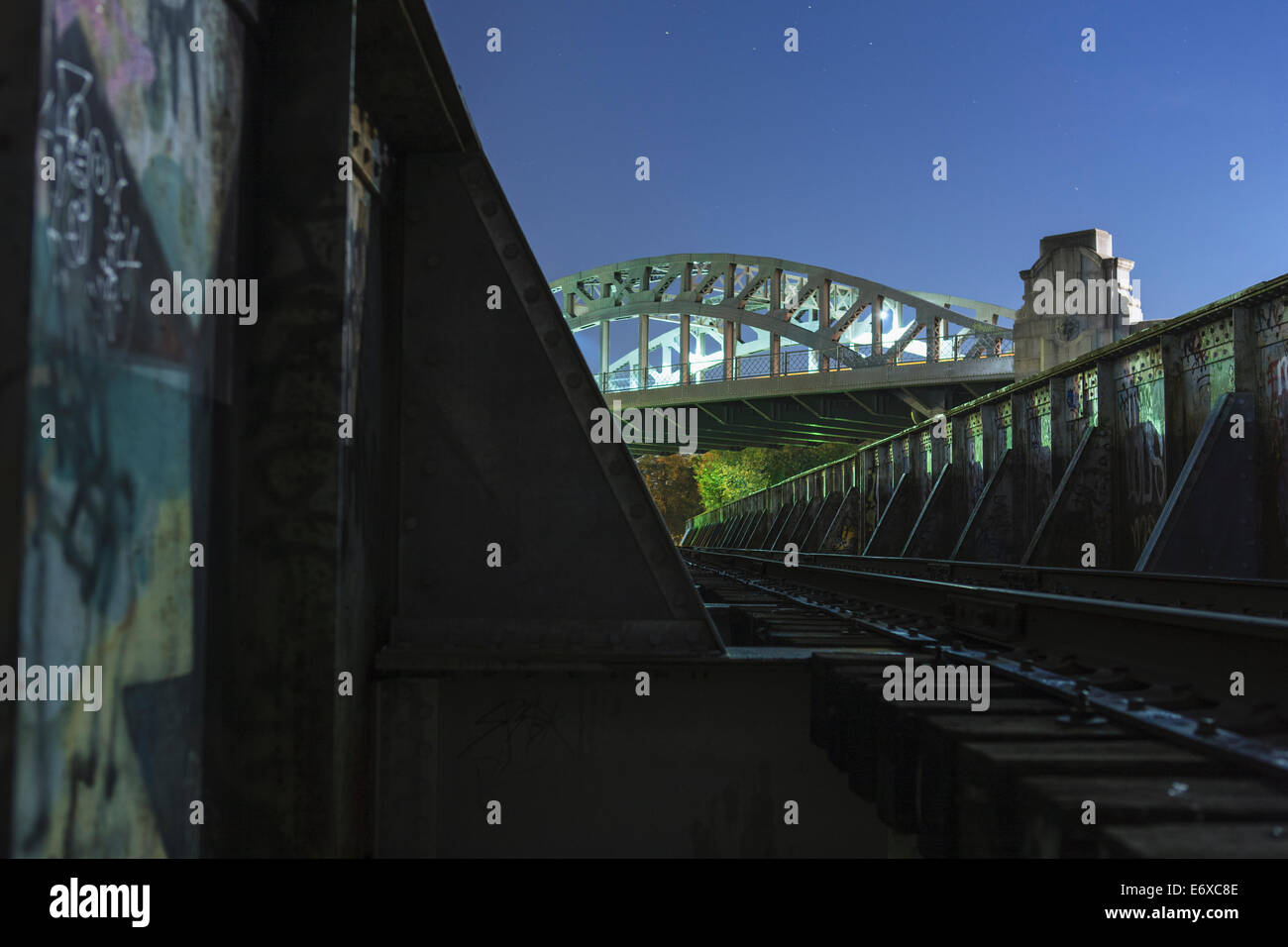 Railroad bridge with view of Boston University Bridge before dawn ...