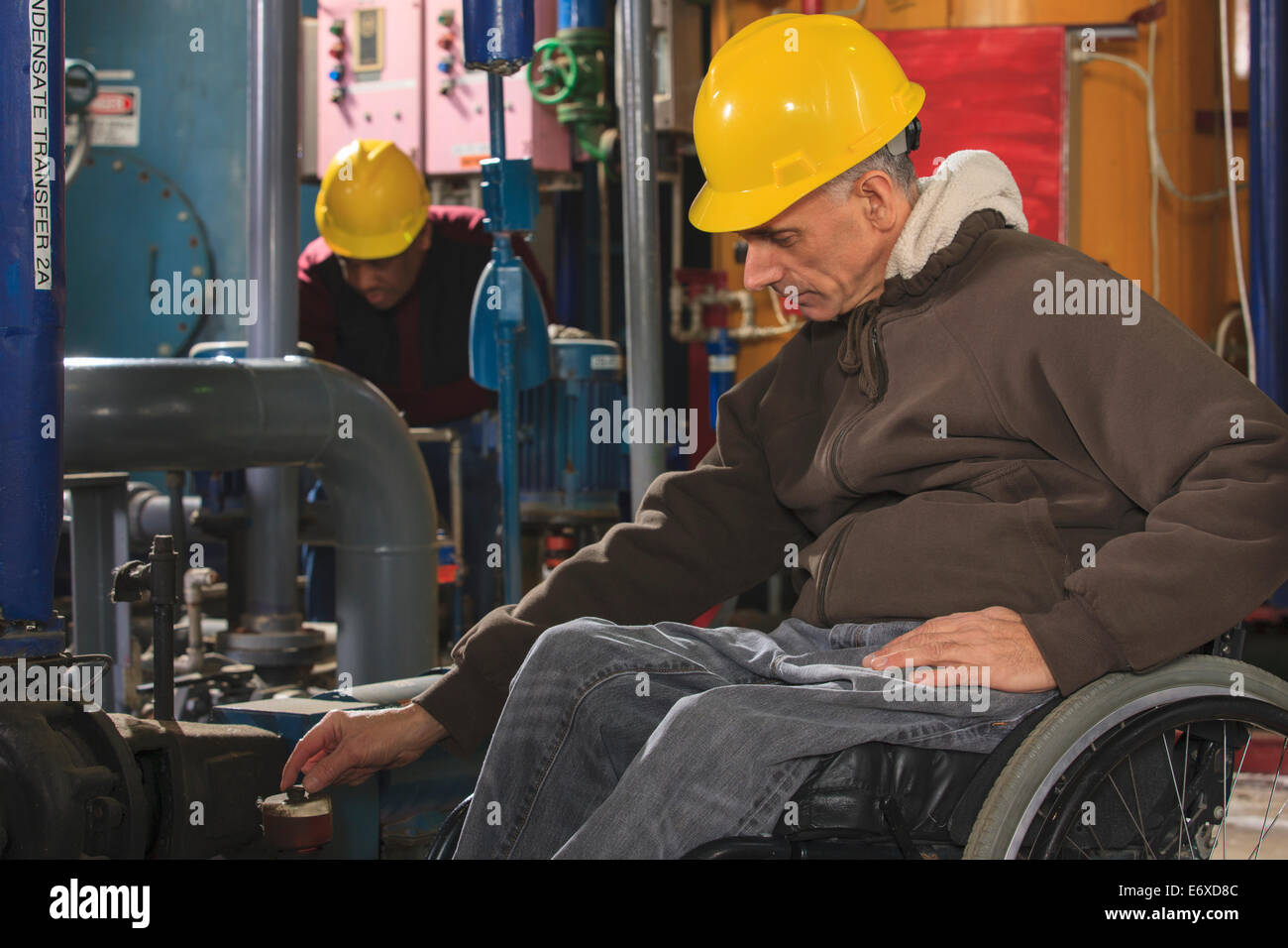 Power plant engineer with spinal cord injury reviewing process ...