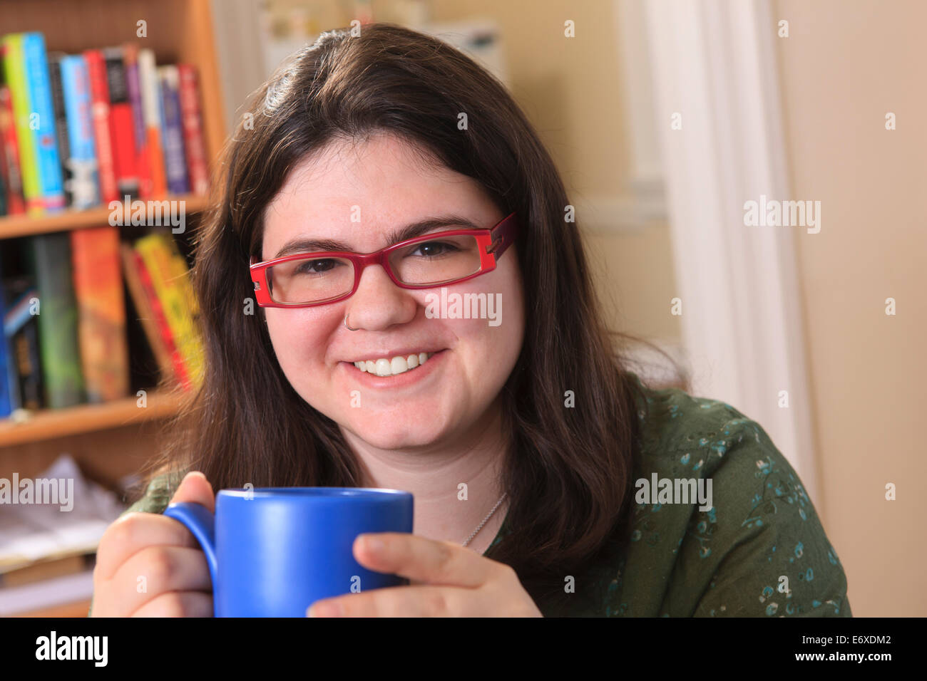 Woman with Aspergers syndrome relaxing with a mug of tea Stock Photo ...