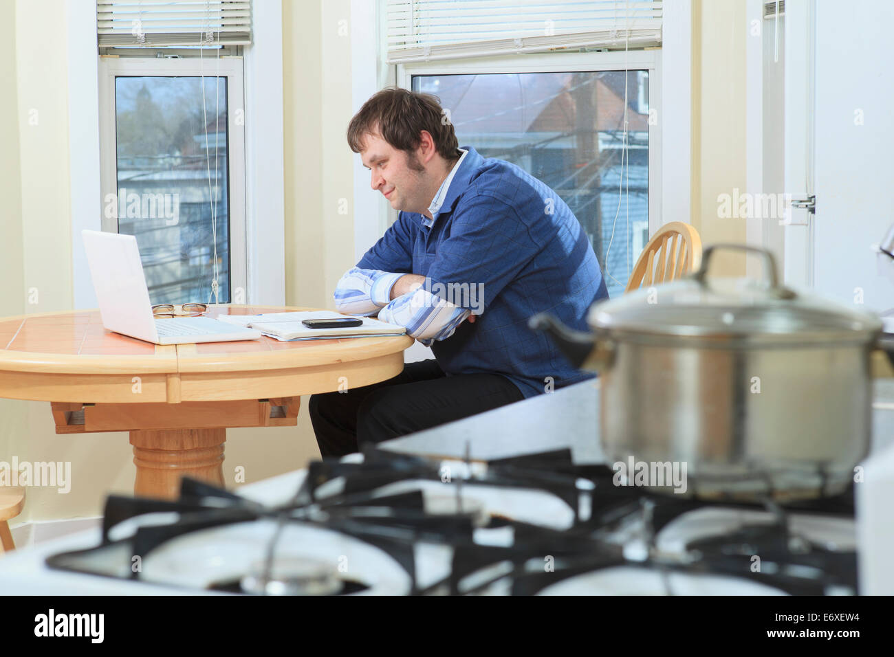 Man working home table hi-res stock photography and images - Alamy