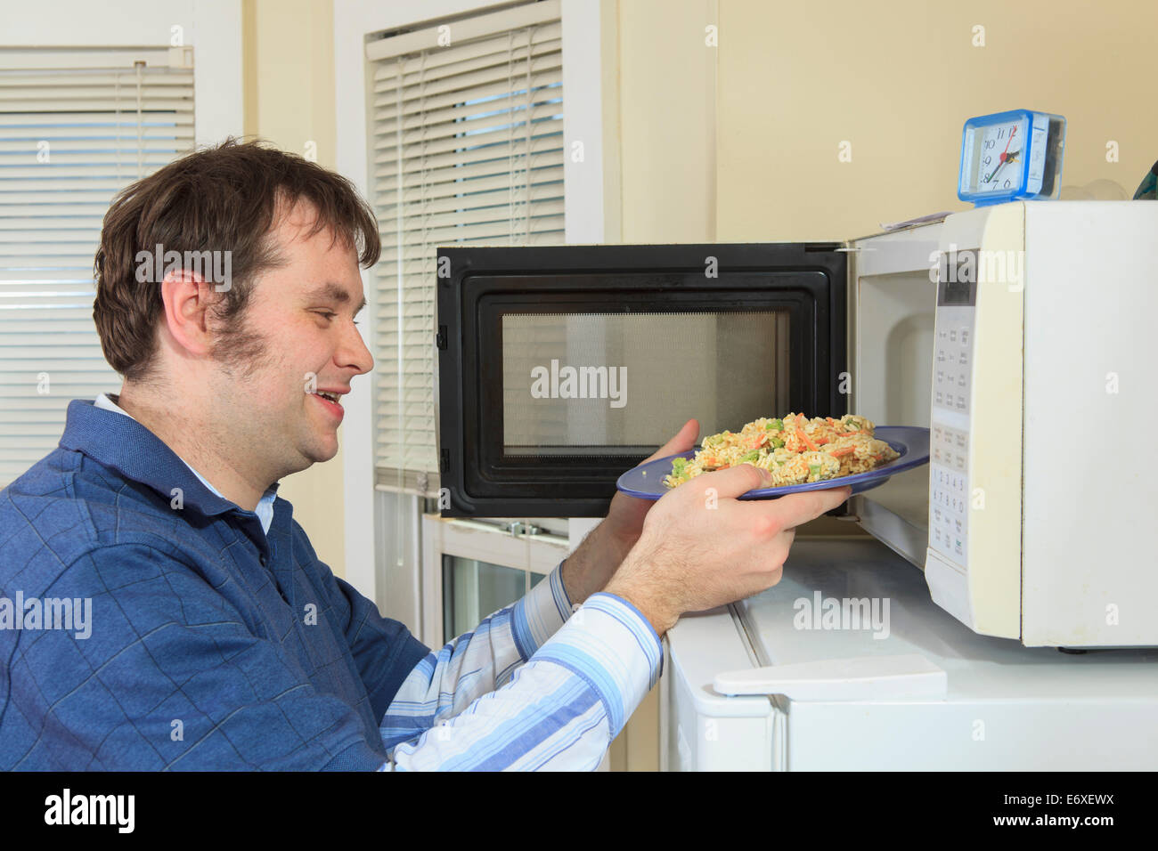 Microwave oven man hi-res stock photography and images - Alamy