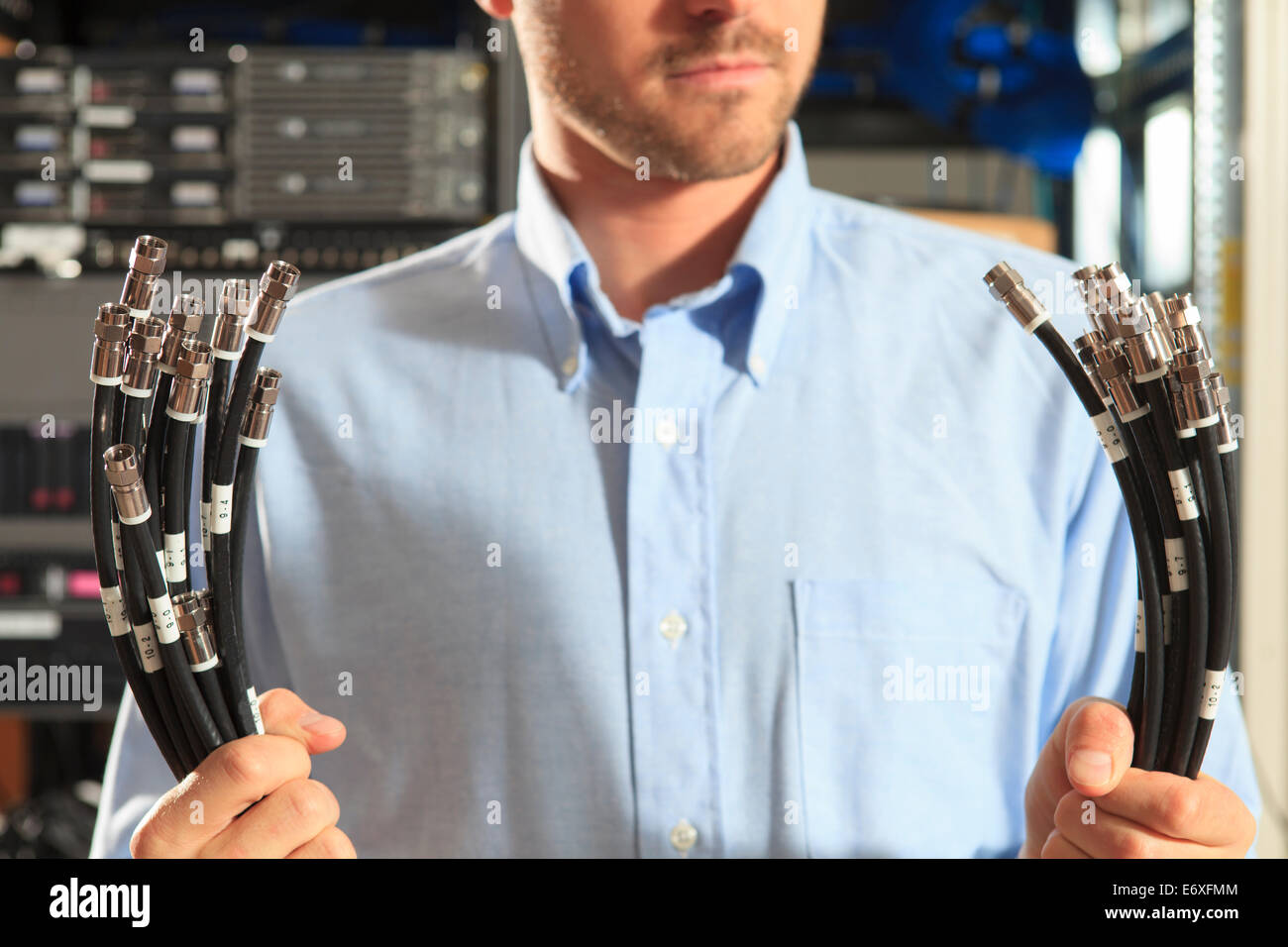 Network engineer preparing structured cabling for data center Stock ...