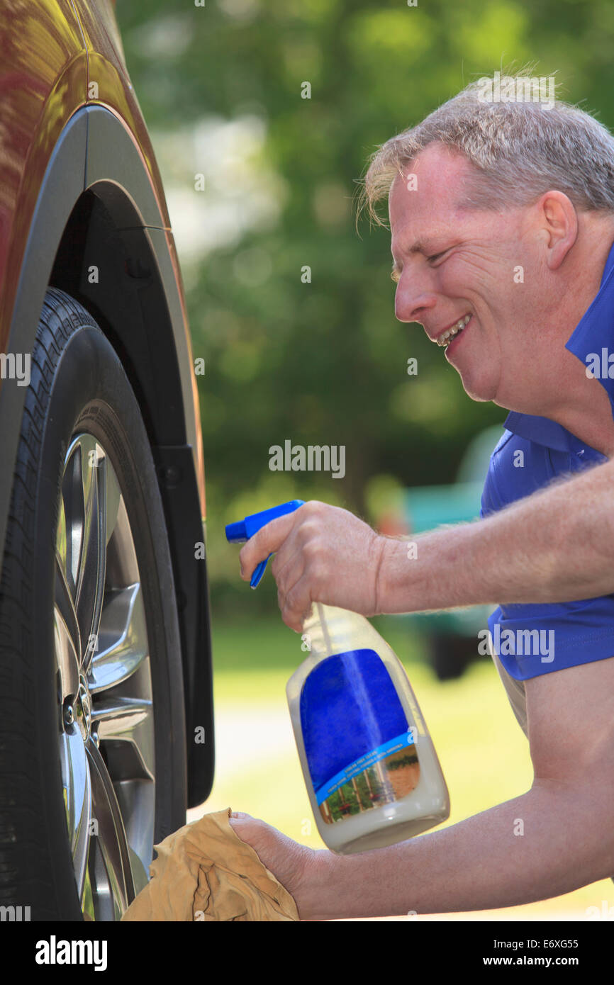 Man with Cerebral Palsy and dyslexia cleaning his tires Stock Photo - Alamy