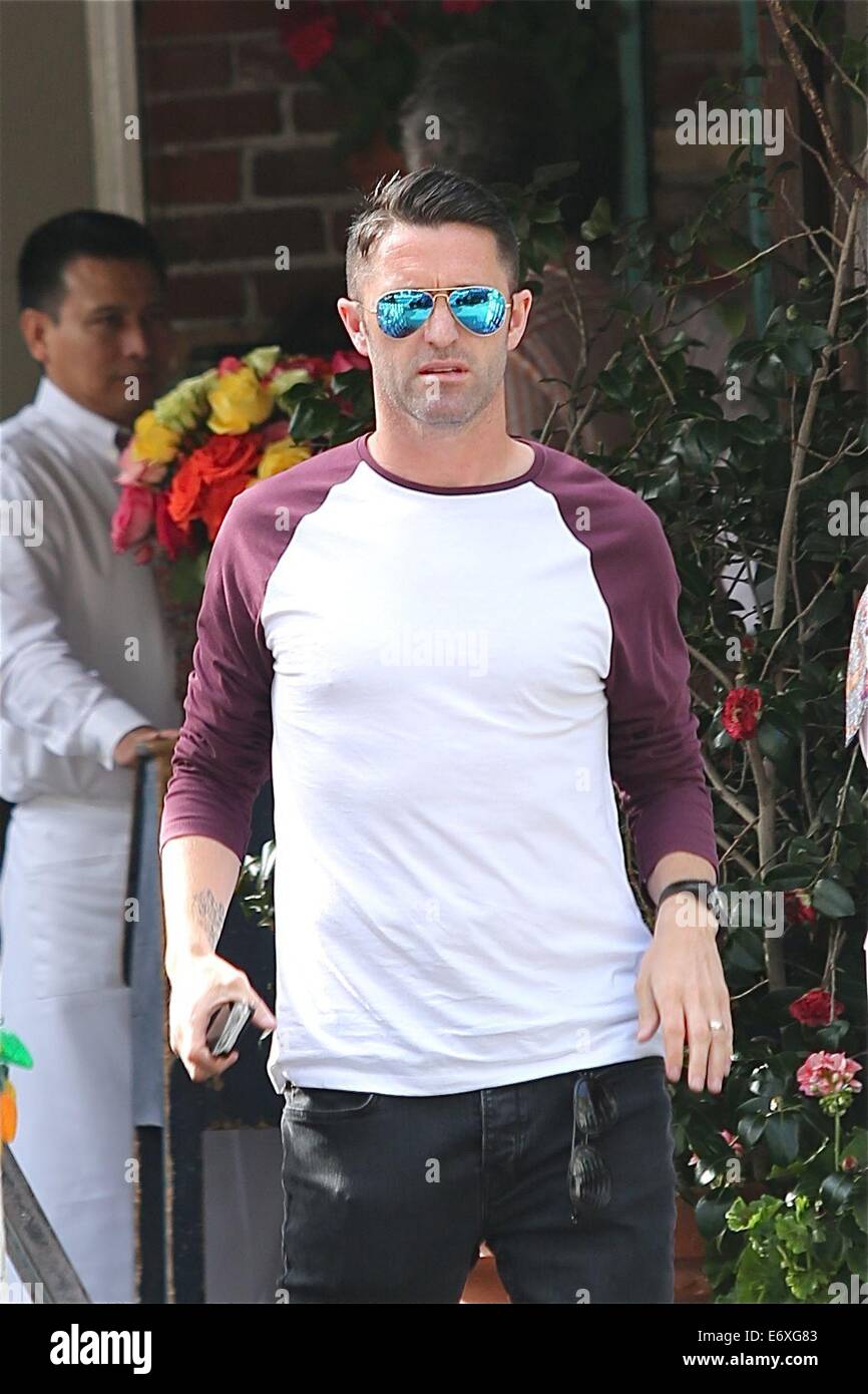 Robbie Keane and Claudine Palmer with their son, Robert Keane Jr, visit ...