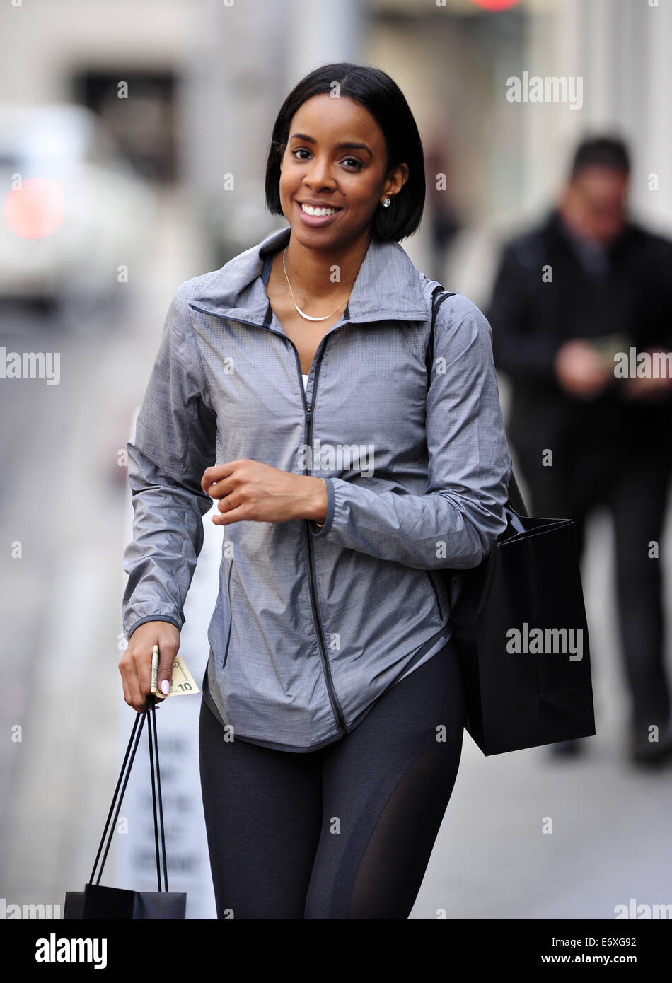 Kelly Rowland shows off her perfect smile after a shopping day out with ...